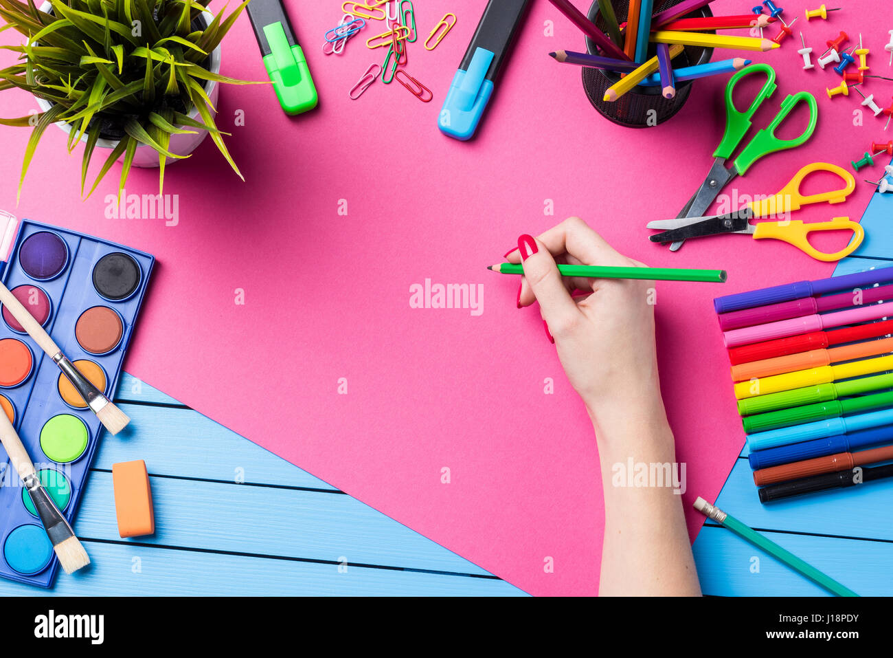Woman's hand drawing on pink paper. School or art background Stock ...