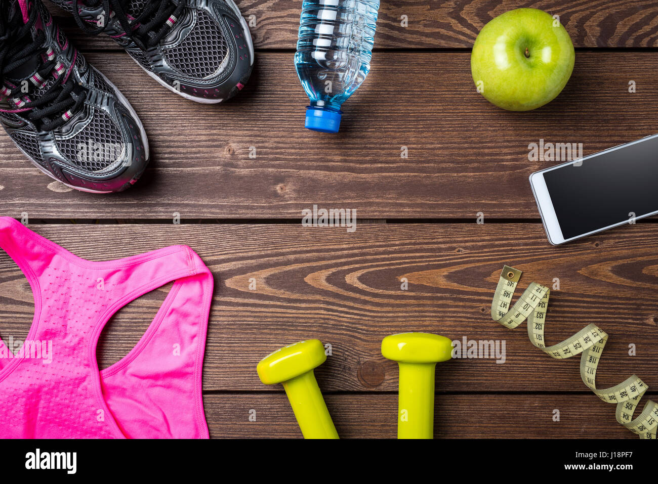 Fitness background with sport equipment on wooden floor. Top view Stock ...
