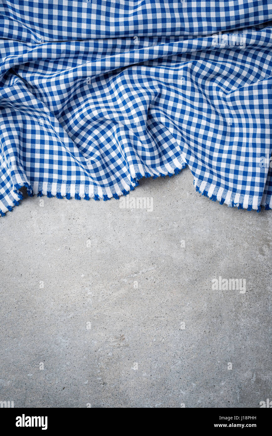 Blue folded tablecloth on gray stone table Stock Photo - Alamy