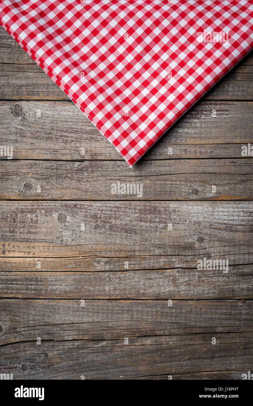 Red checkered tablecloth on wooden table with copyspace Stock Photo - Alamy