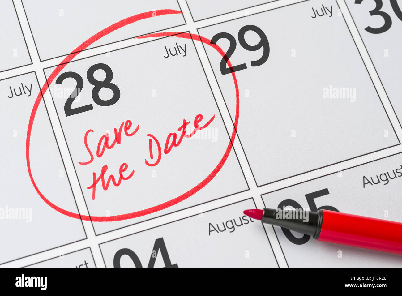 Save the Date written on a calendar - July 28 Stock Photo - Alamy