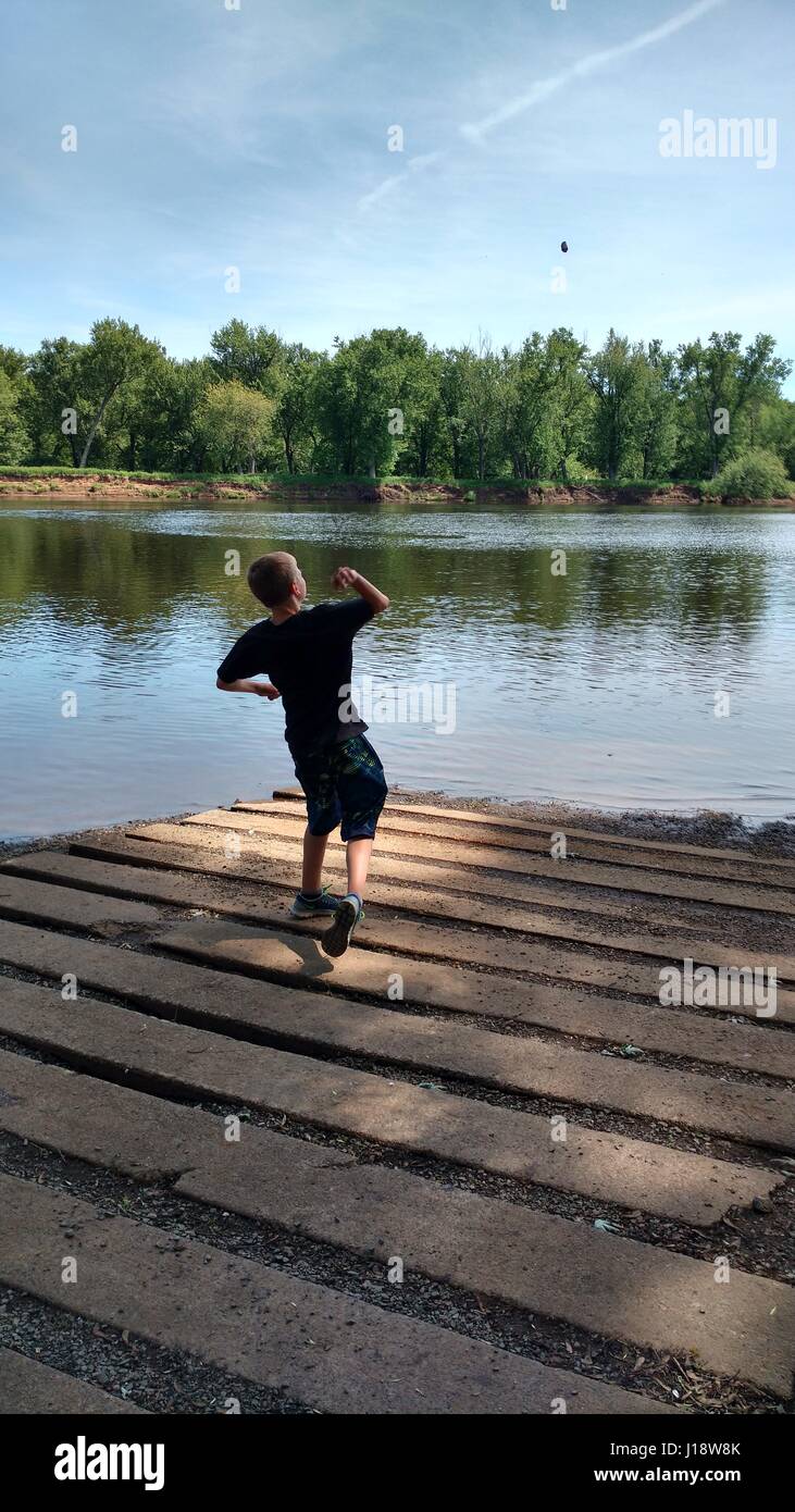 Throwing Rocks In Water High Resolution Stock Photography and Images ...