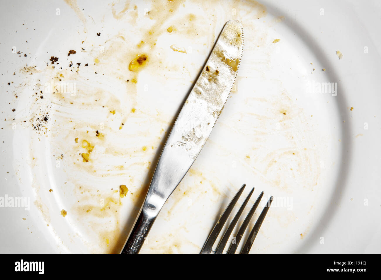 single dirty dinner plate on table top looking down from above Stock ...