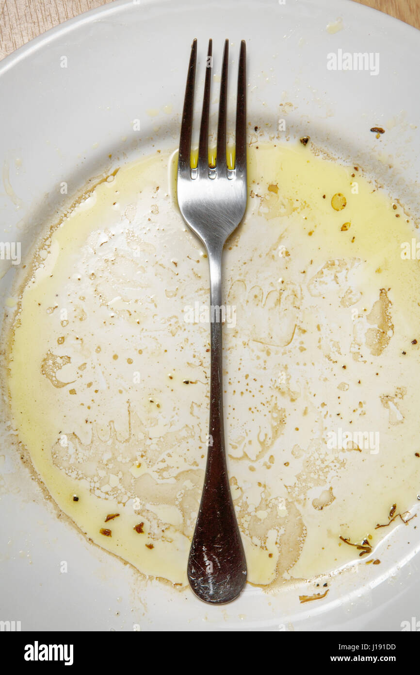 single dirty dinner plate on table top looking down from above Stock ...