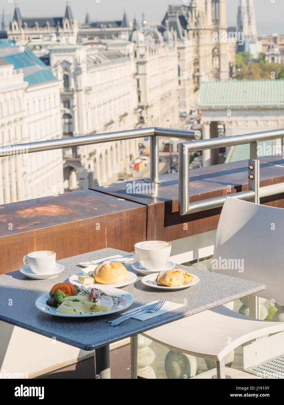 Small table with served breakfast on balcony Stock Photo - Alamy