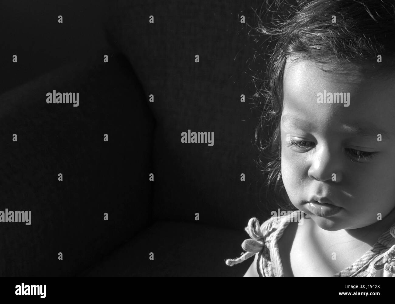 A young girl is in a contemplative mood Stock Photo - Alamy