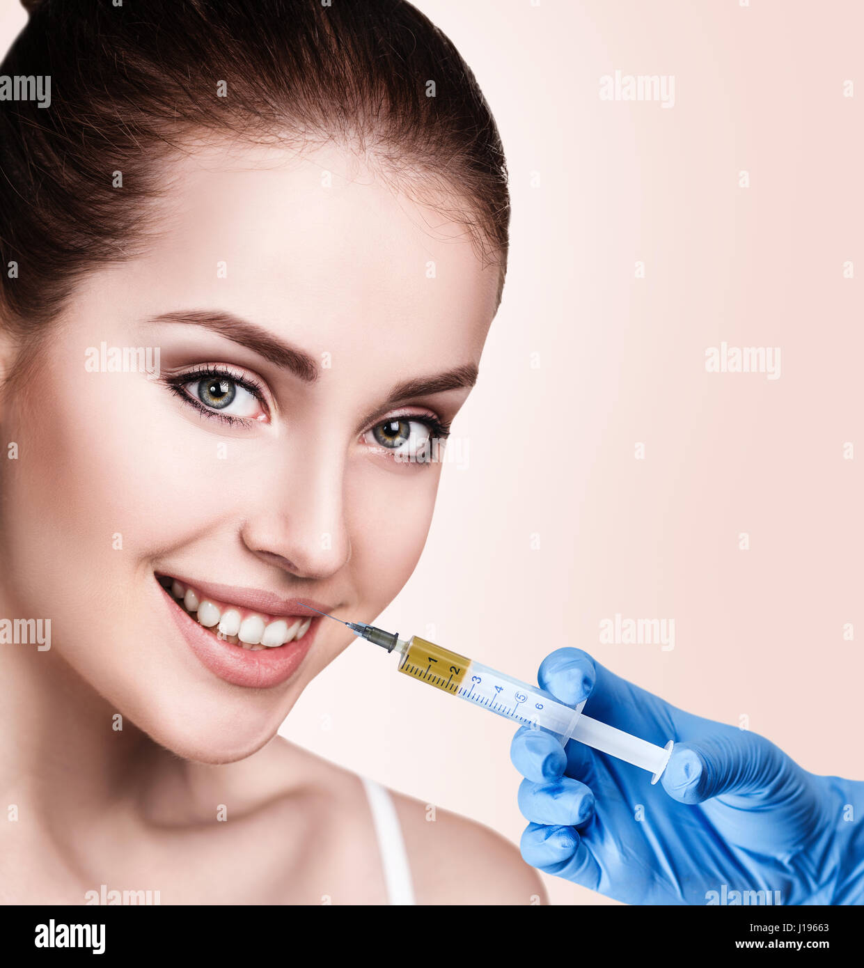 Young woman getting cosmetics injection Stock Photo - Alamy