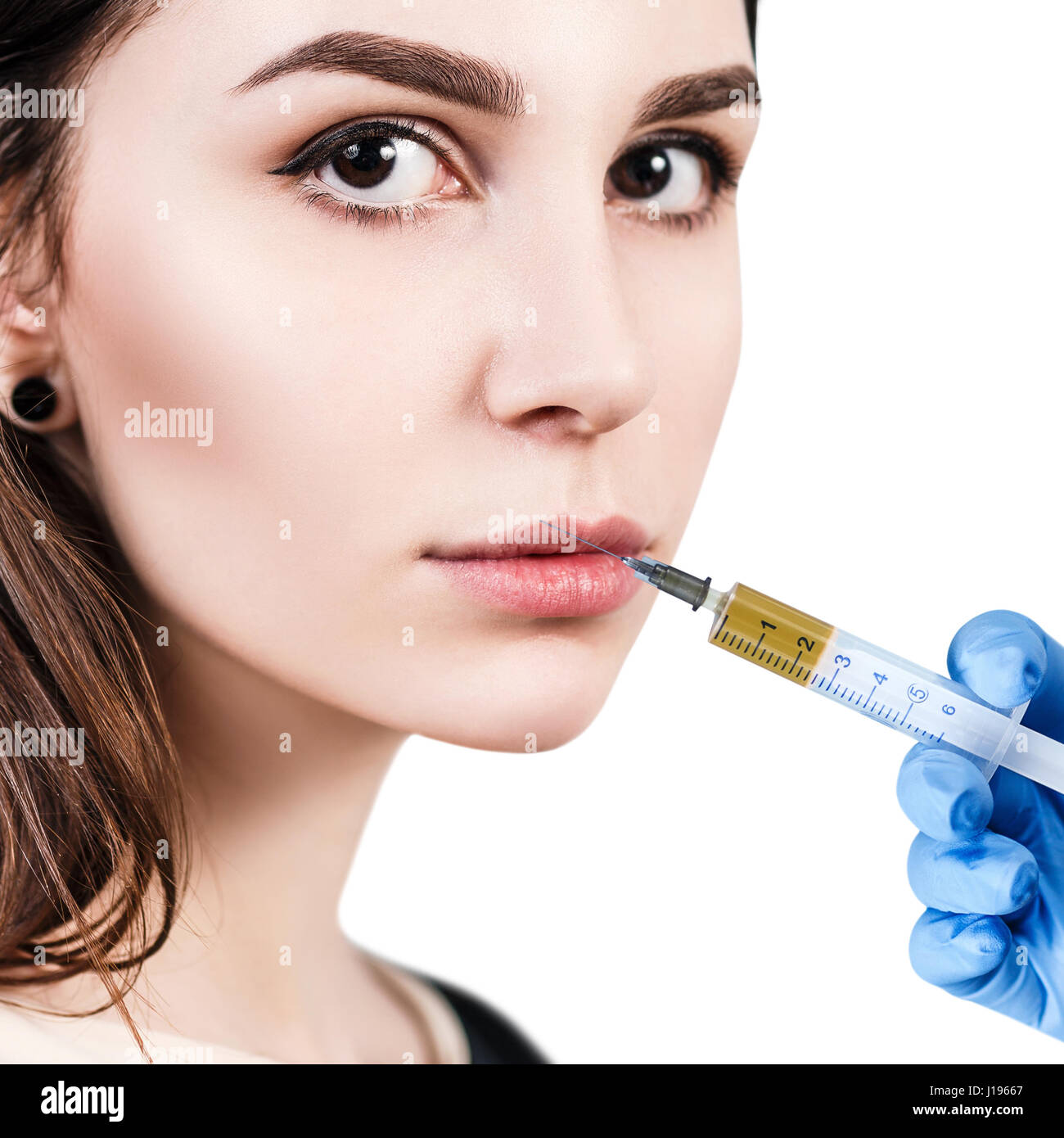 Young woman getting cosmetics injection Stock Photo - Alamy