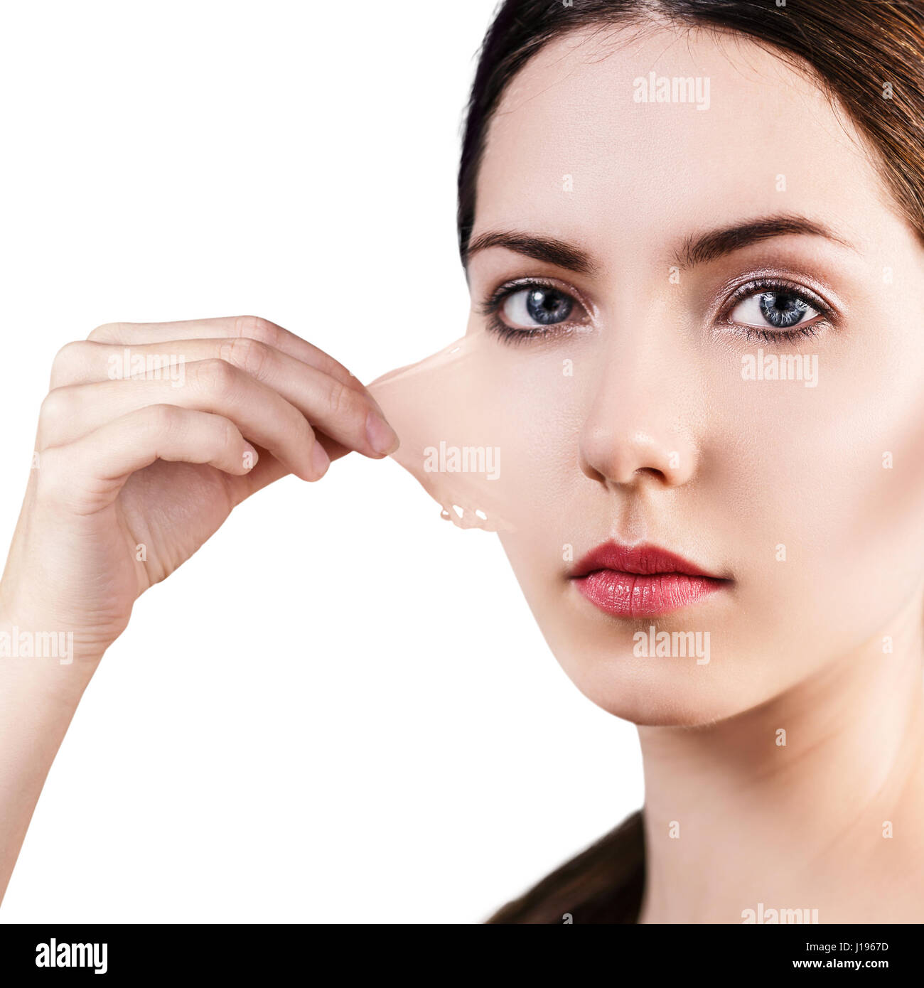 Woman remove her old dry skin from face Stock Photo - Alamy