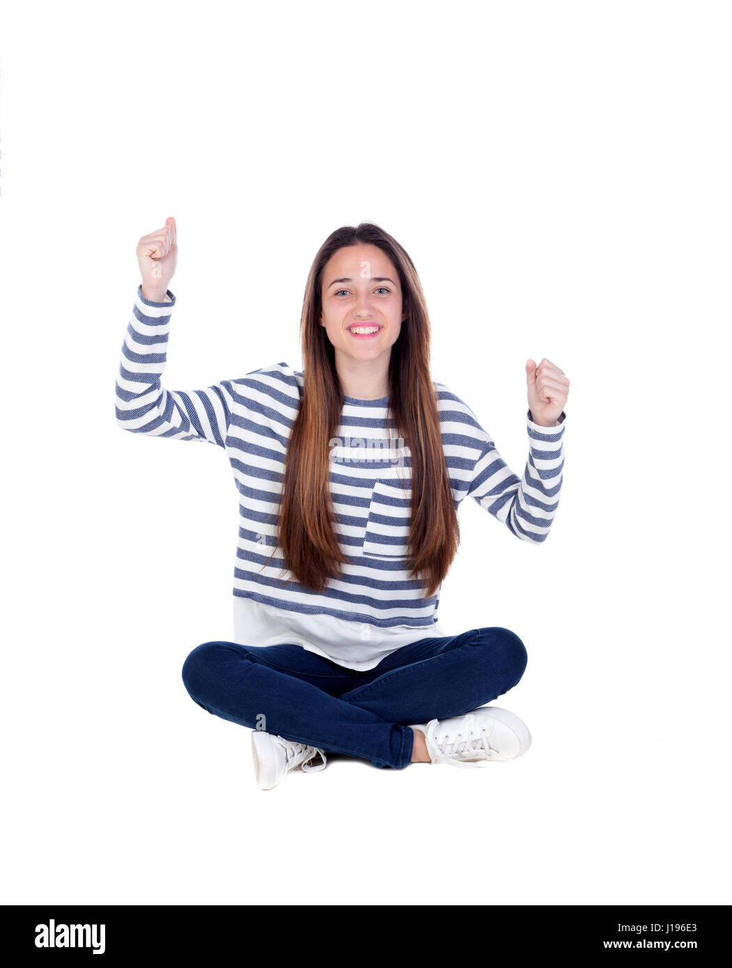 Happy teenager girl celebrating something leaving her hands isolated on ...