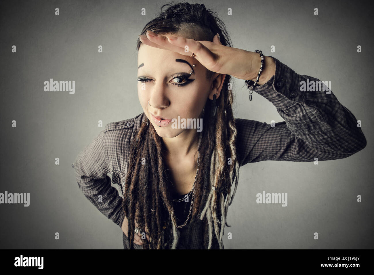 Alternative woman looking at the distance Stock Photo - Alamy
