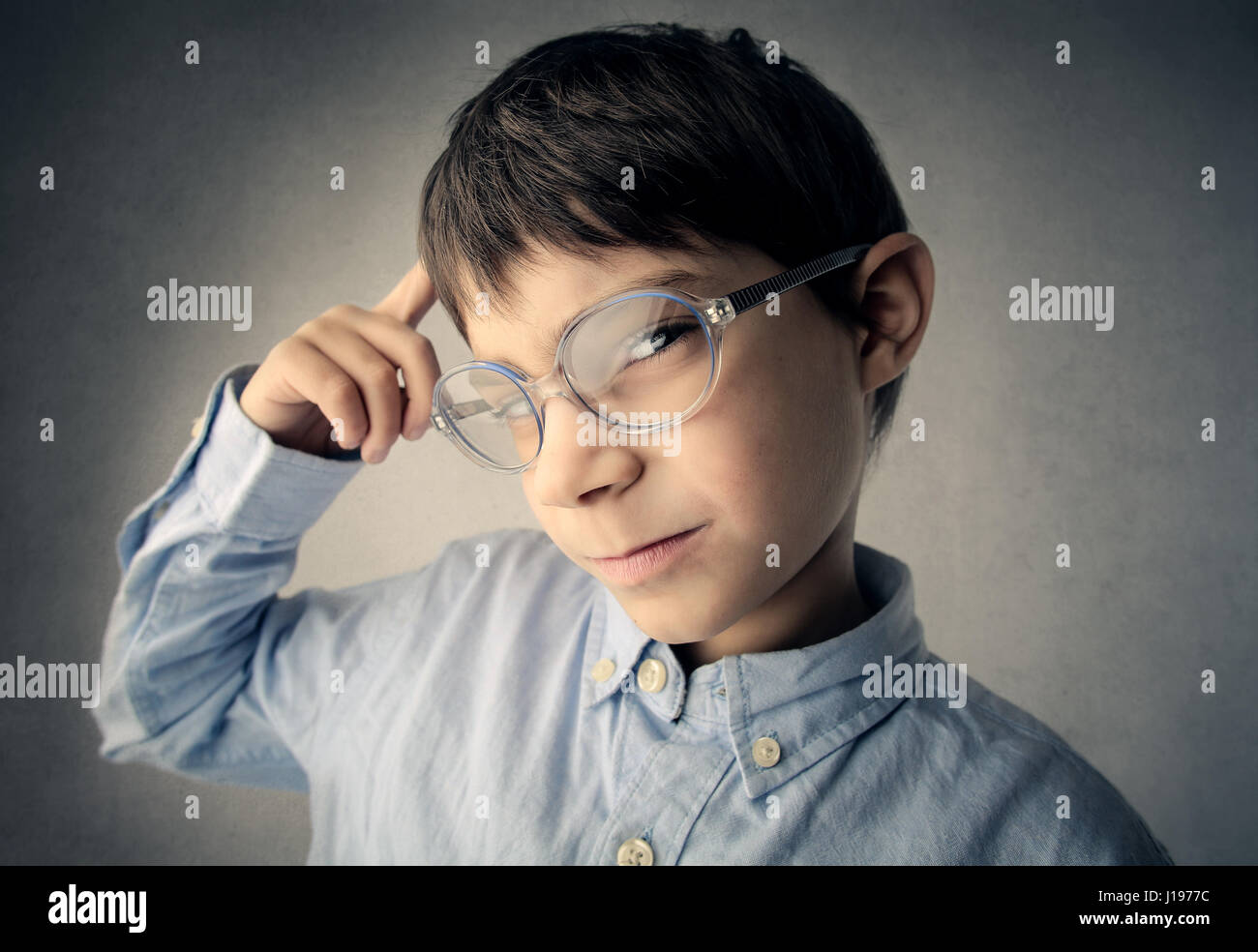 Little boy thinking Stock Photo - Alamy
