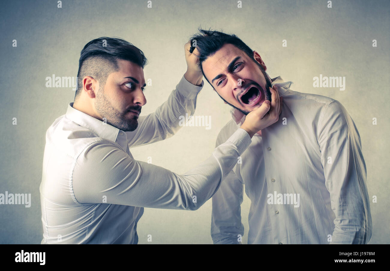 Man killing another crying man Stock Photo - Alamy