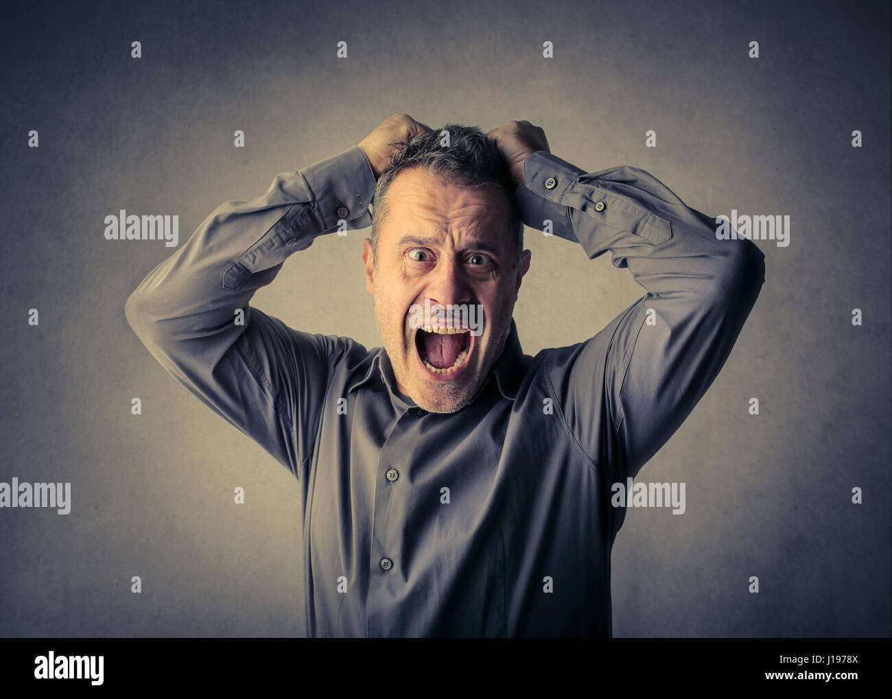 Mad businessman yelling Stock Photo - Alamy