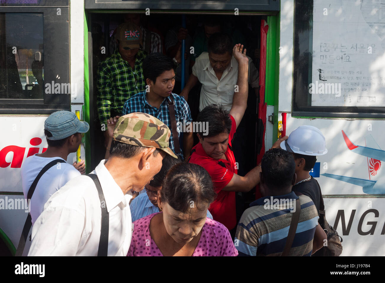 Passengers getting off a bus hi-res stock photography and images - Alamy
