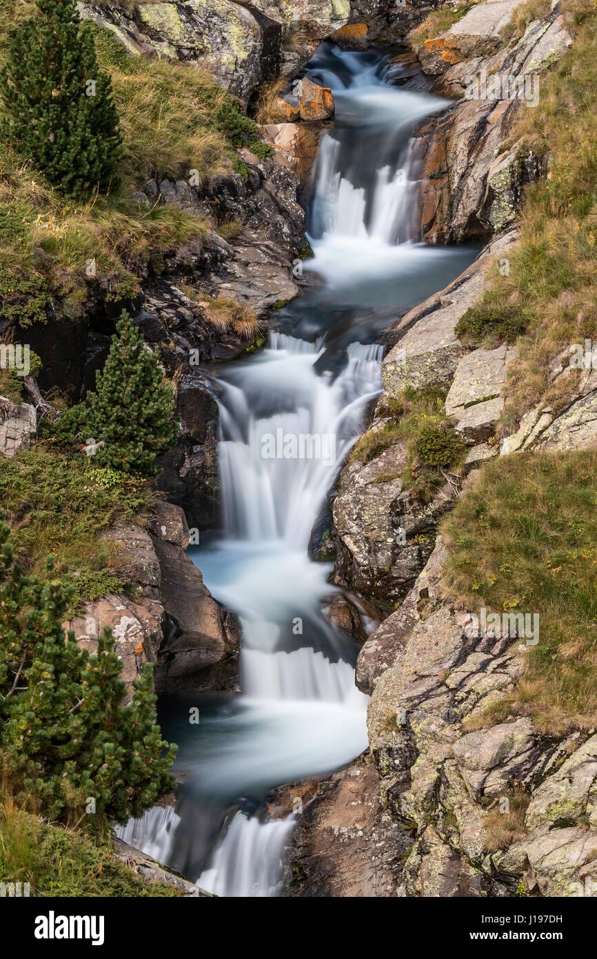 Beautiful veil cascading waterfall, mossy rocks in Pyrenees in Spain ...