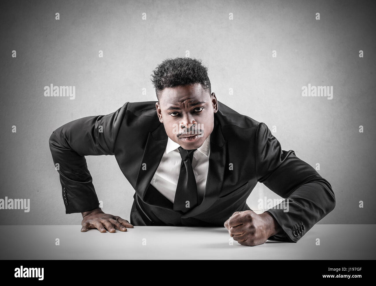 Black businessman being mad and strict Stock Photo - Alamy