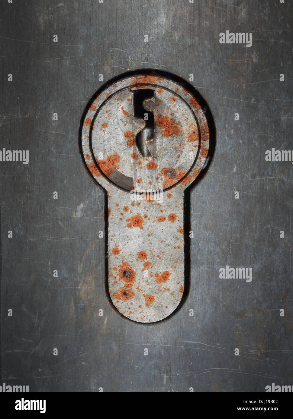Cylinder lock closeup, rusty, cylinder in the middle Stock Photo - Alamy