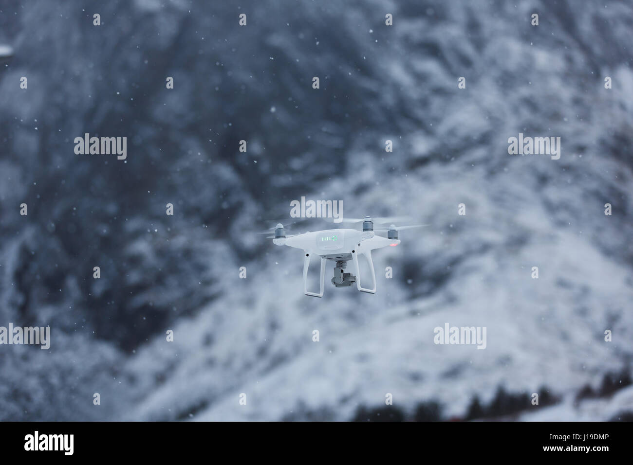 The drone is flying in winter mountain Stock Photo - Alamy