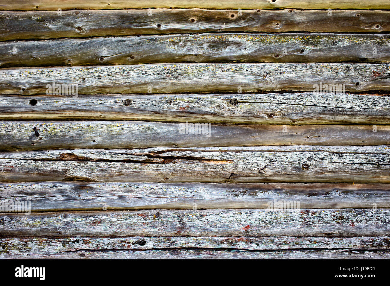 Wooden background of old logs worn by time Stock Photo - Alamy