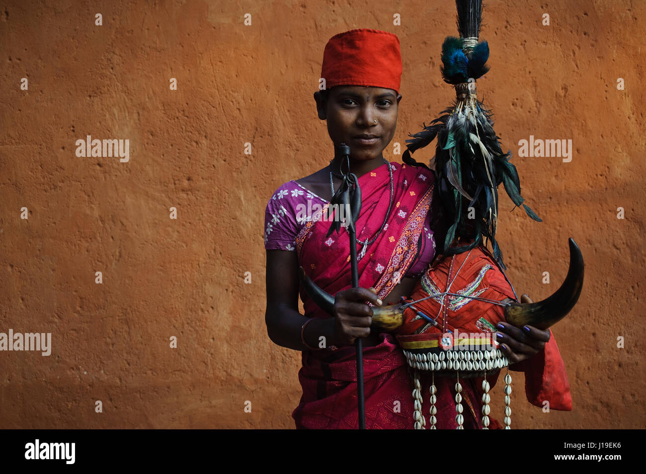 Girl from the Bison Horn Maria tribe ( India) She is holding the mask ...