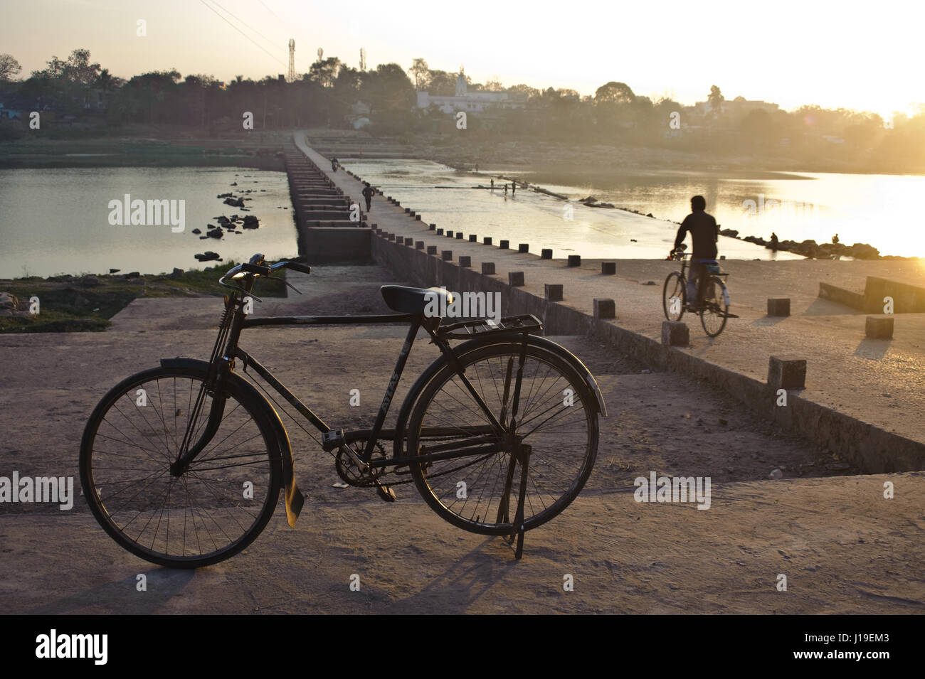 Cycle + rider going to work near the Hasdeo river ( India Stock Photo ...