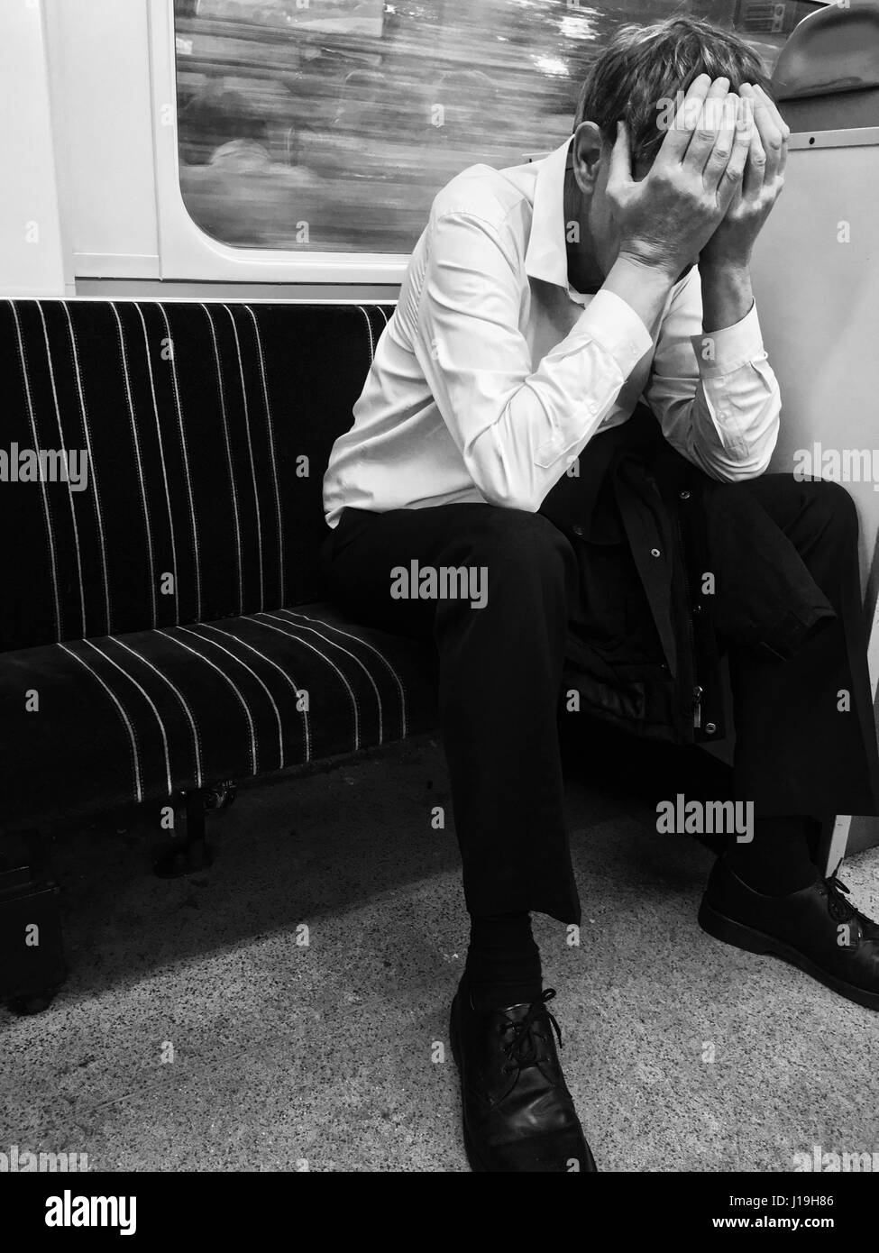 Man Sat On Train With Head In Hands High Resolution Stock Photography ...