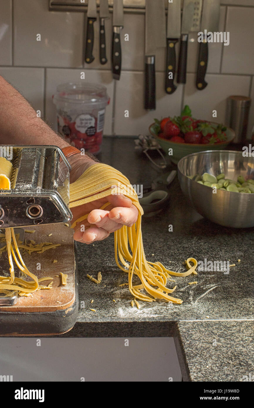Making pasta at home with pasta machine Stock Photo - Alamy