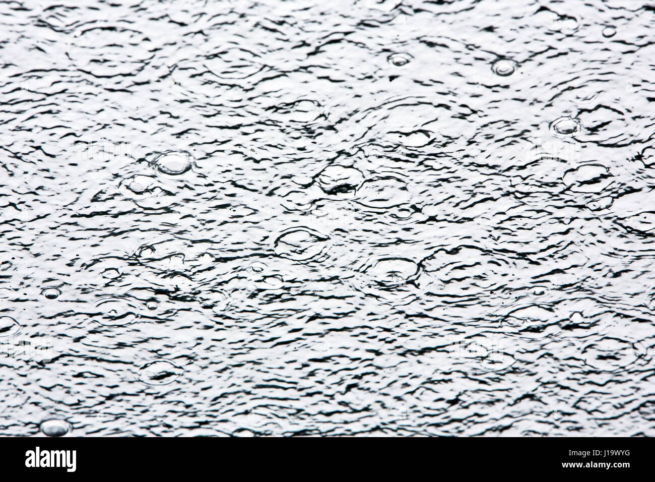 Abstract photo of water falling on glass creating patterns Stock Photo ...