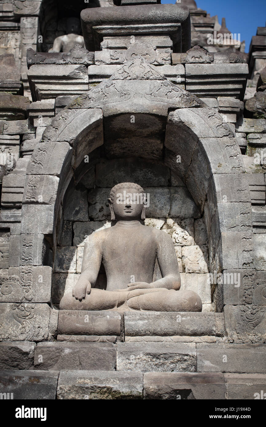 A meditating Buddha statue at the Borobudur in Indonesia, Asia Stock ...