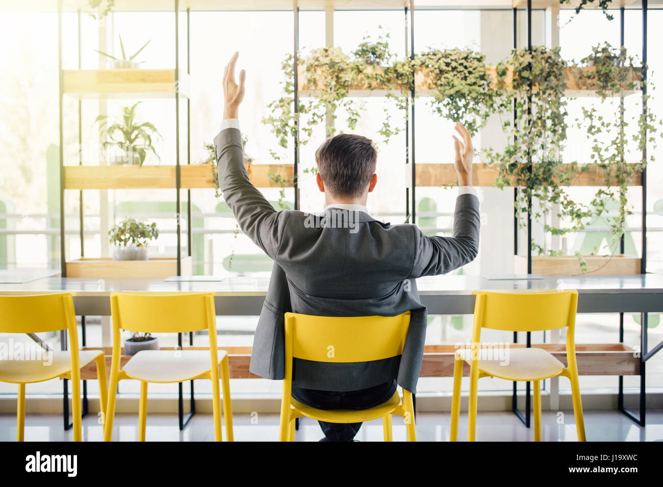 Back view man raised fist hi-res stock photography and images - Alamy