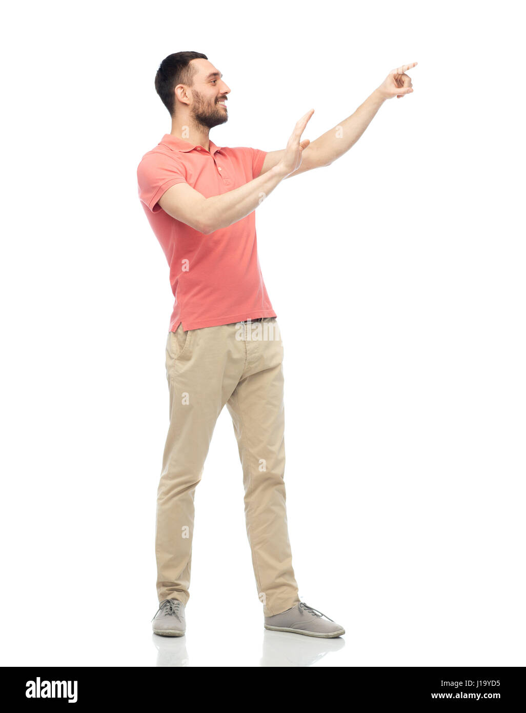 happy man touching something imaginary Stock Photo - Alamy