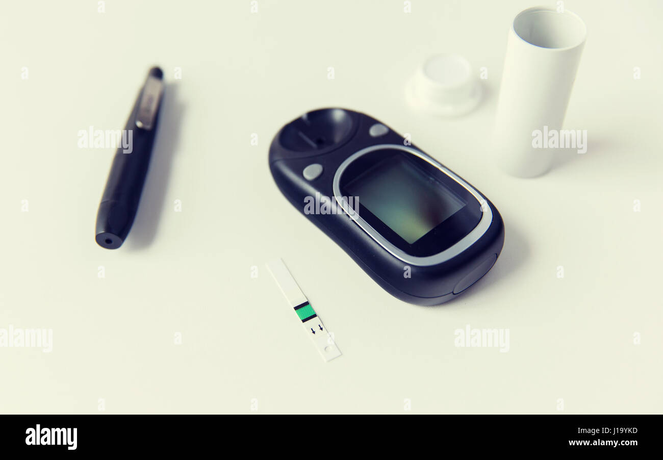 close up of glucometer and blood sugar test stripe Stock Photo - Alamy