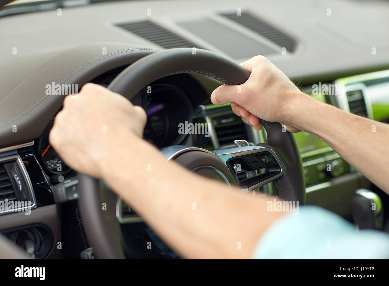 Hands man driving car close hi-res stock photography and images - Alamy