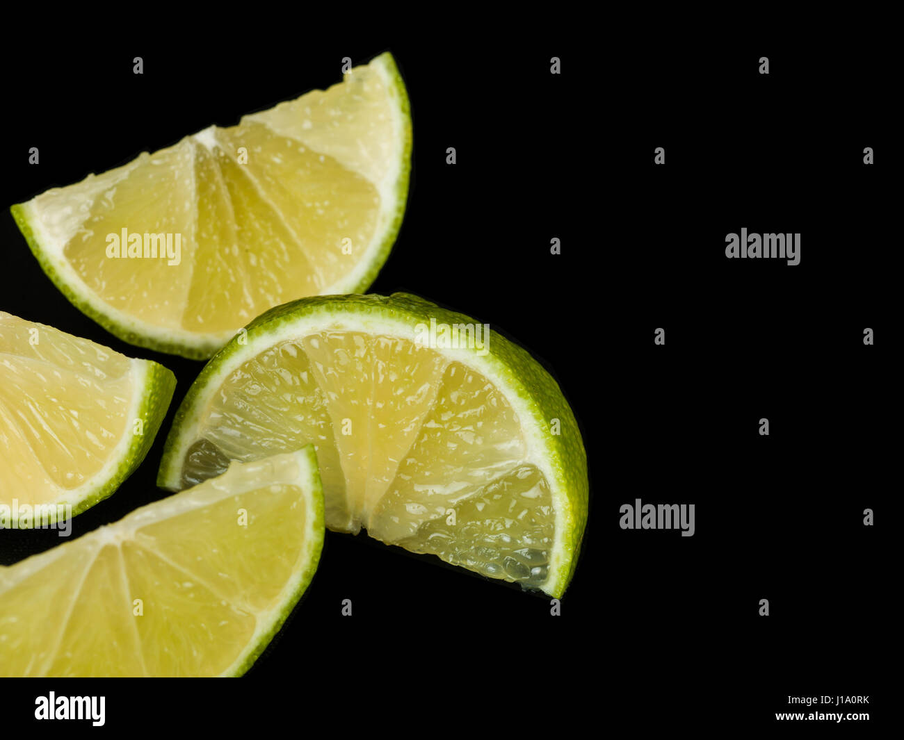 Fresh Ripe Juicy Lime Segments Against a Black Background Stock Photo ...