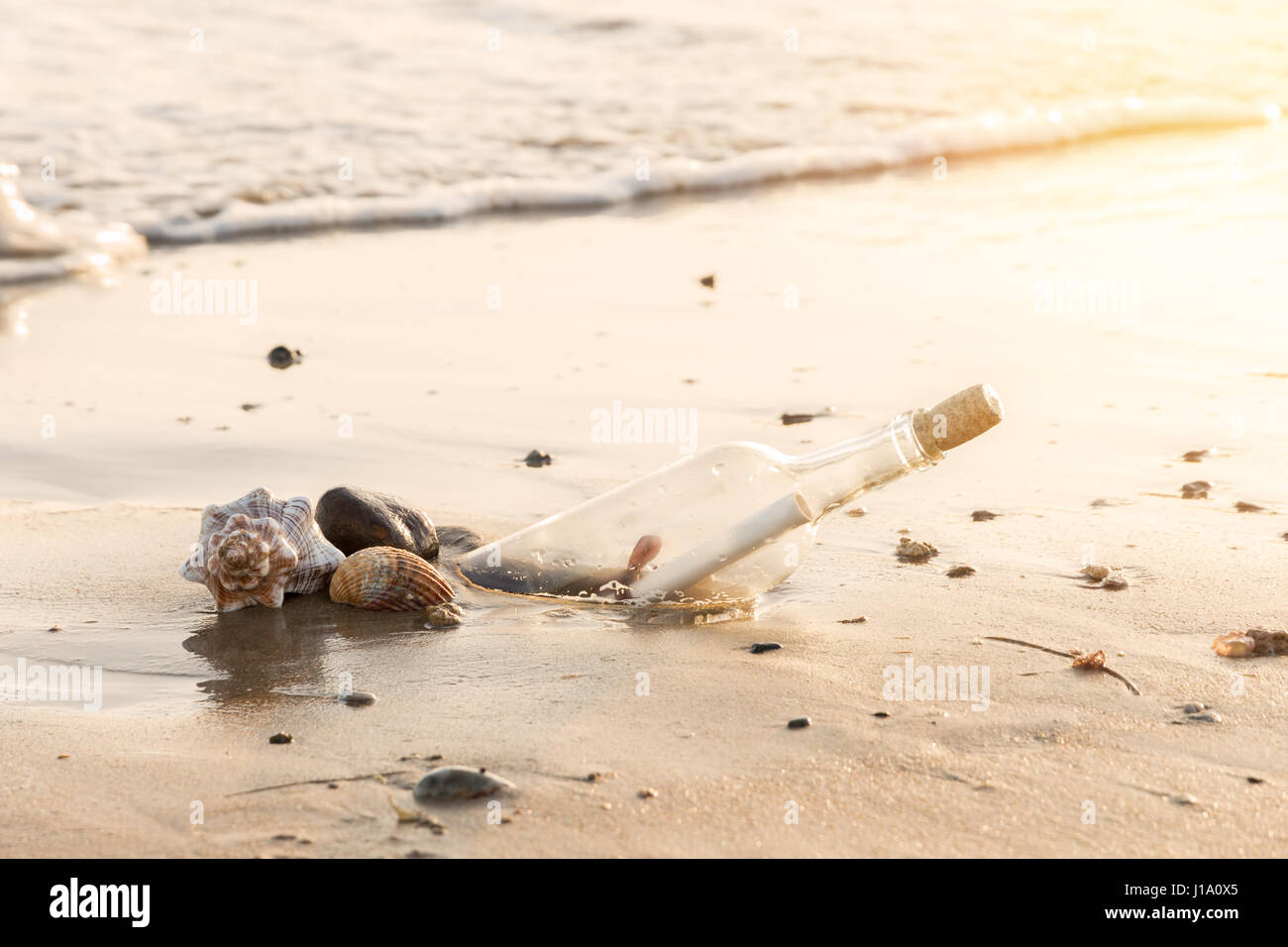 Message in a Bottle on the beach Stock Photo - Alamy