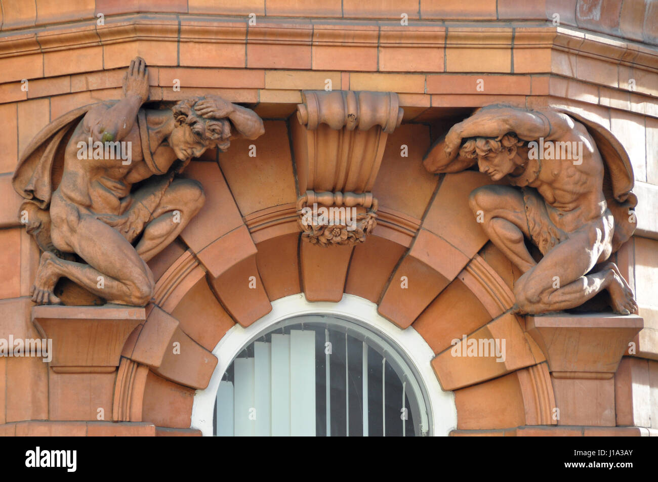 Architecture showing two male sculptures supporting a shelf, Manchester ...