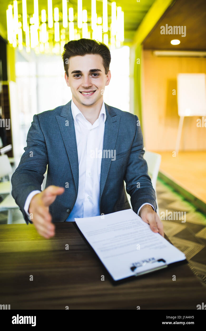 handsome buisnessman with open hand ready for handshake Stock Photo - Alamy