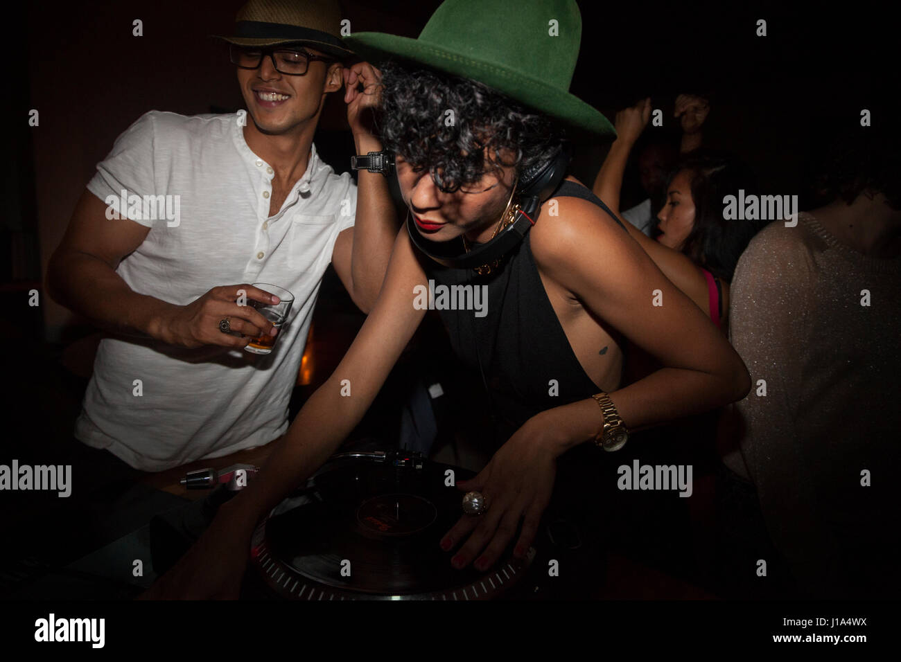 Young woman djing at a club Stock Photo - Alamy