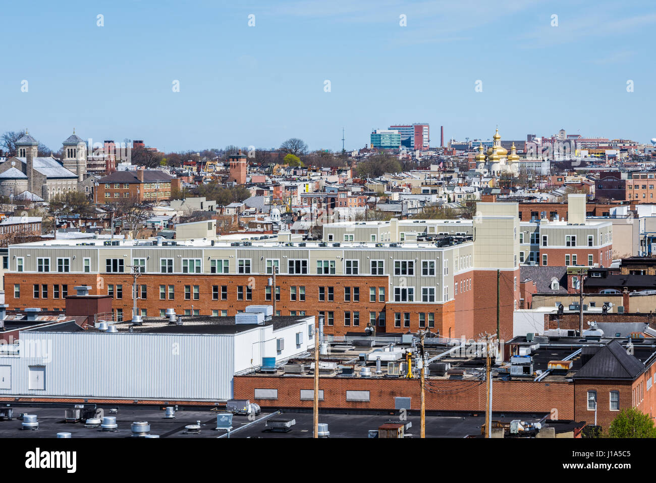 Aerial of downtown baltimore, maryland towards patterson park in spring ...