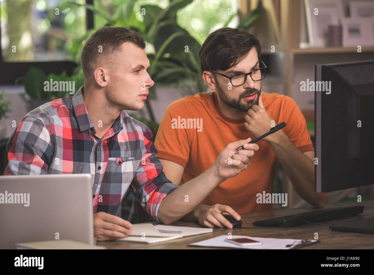 Young men programmers working together in the office Stock Photo - Alamy
