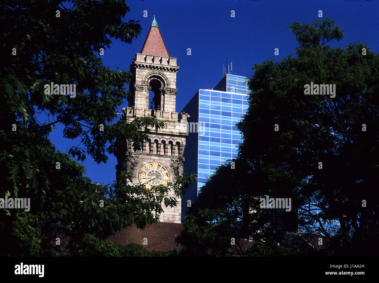 The City Hall Tower with a modern office building in downtown Worcester ...