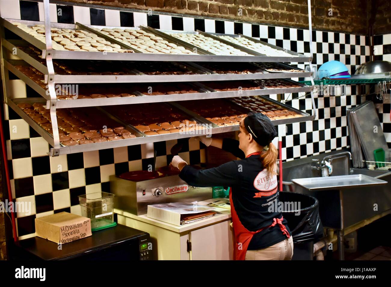 Charleston, South Carolina woman making candy at Savannah's Candy ...
