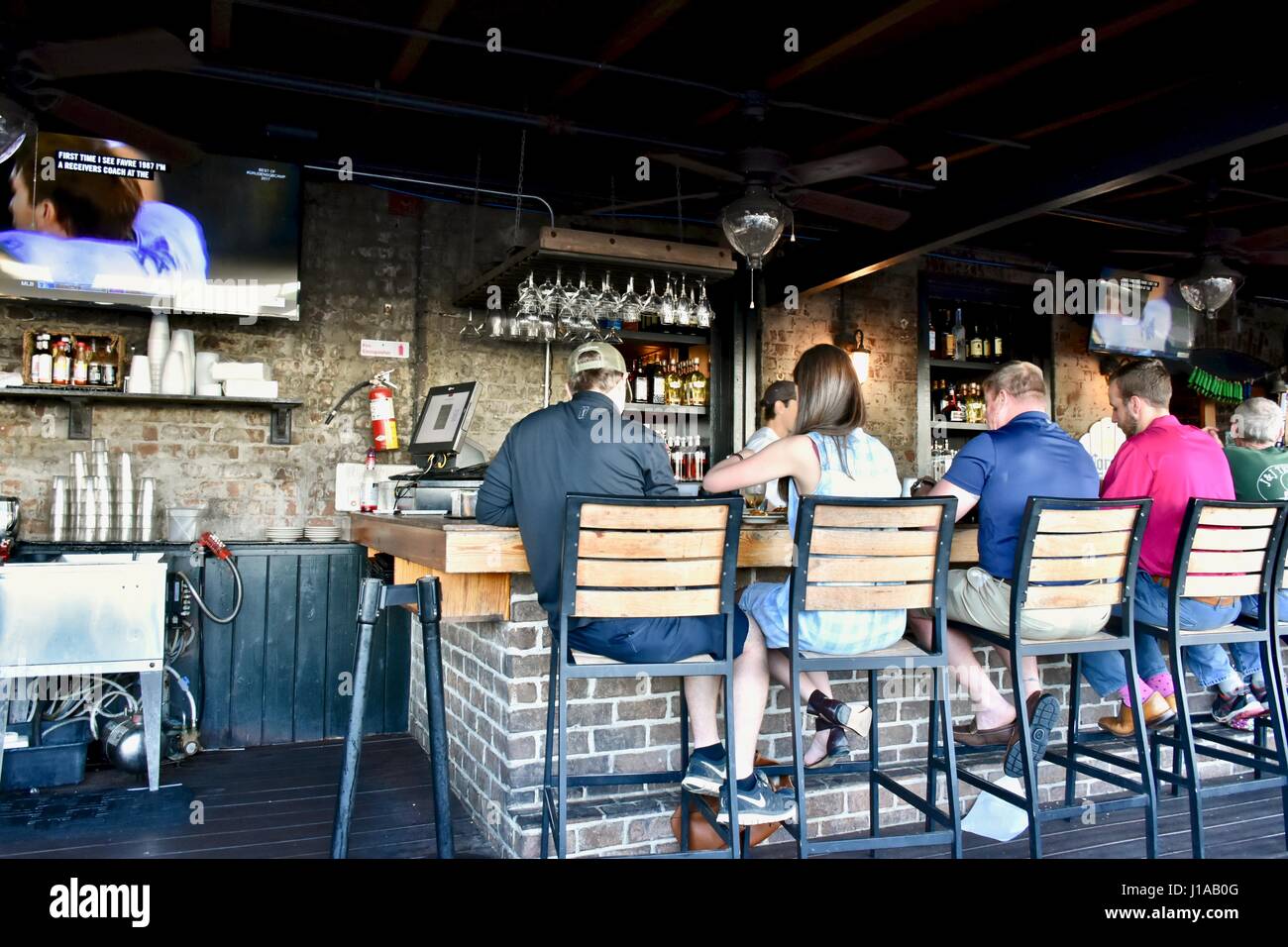 People sitting at a restaurant bar Stock Photo - Alamy