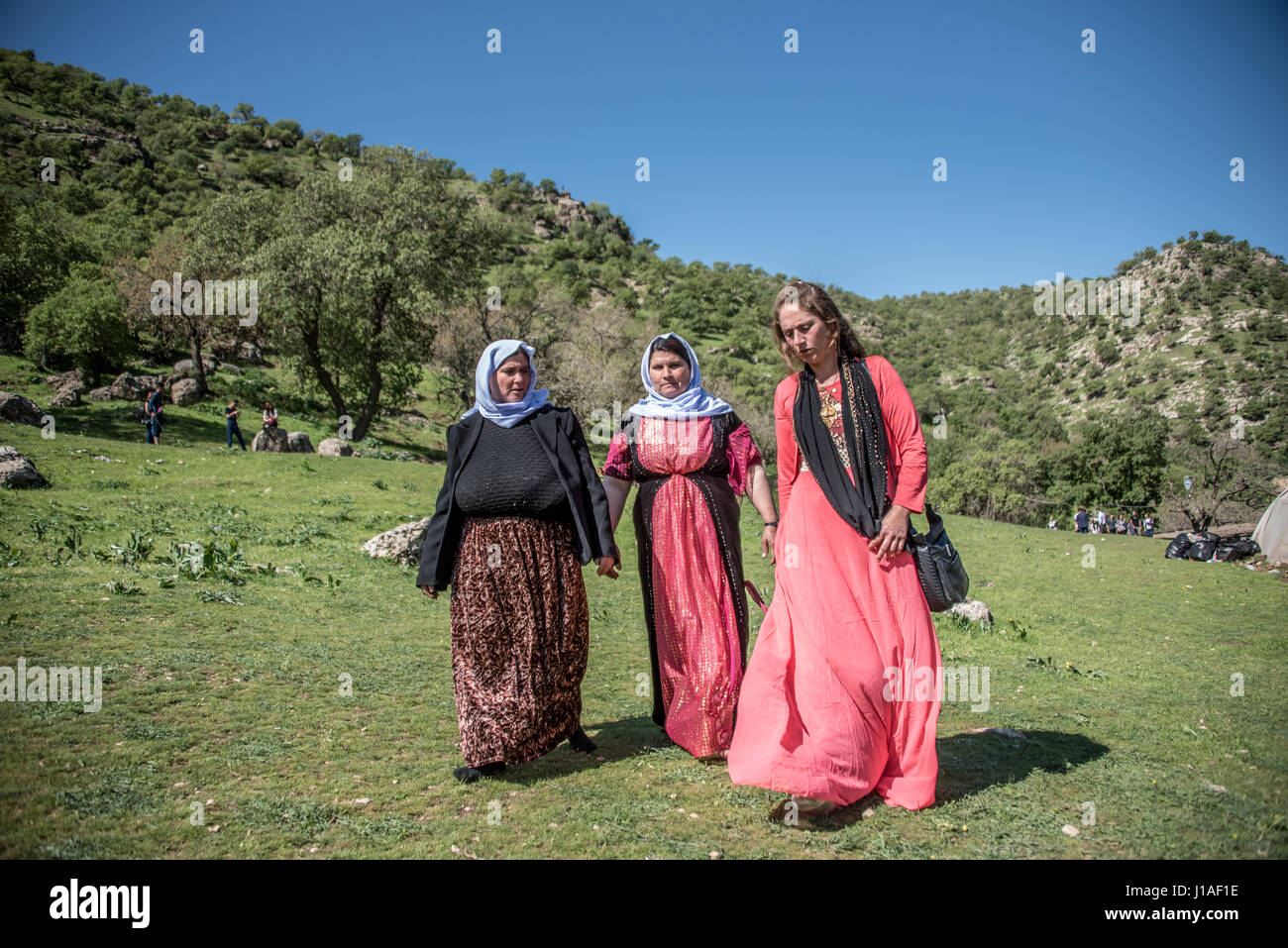 Lalish, Iraqi Kurdistan. 19th April, 2017. Yezidi women walking through ...