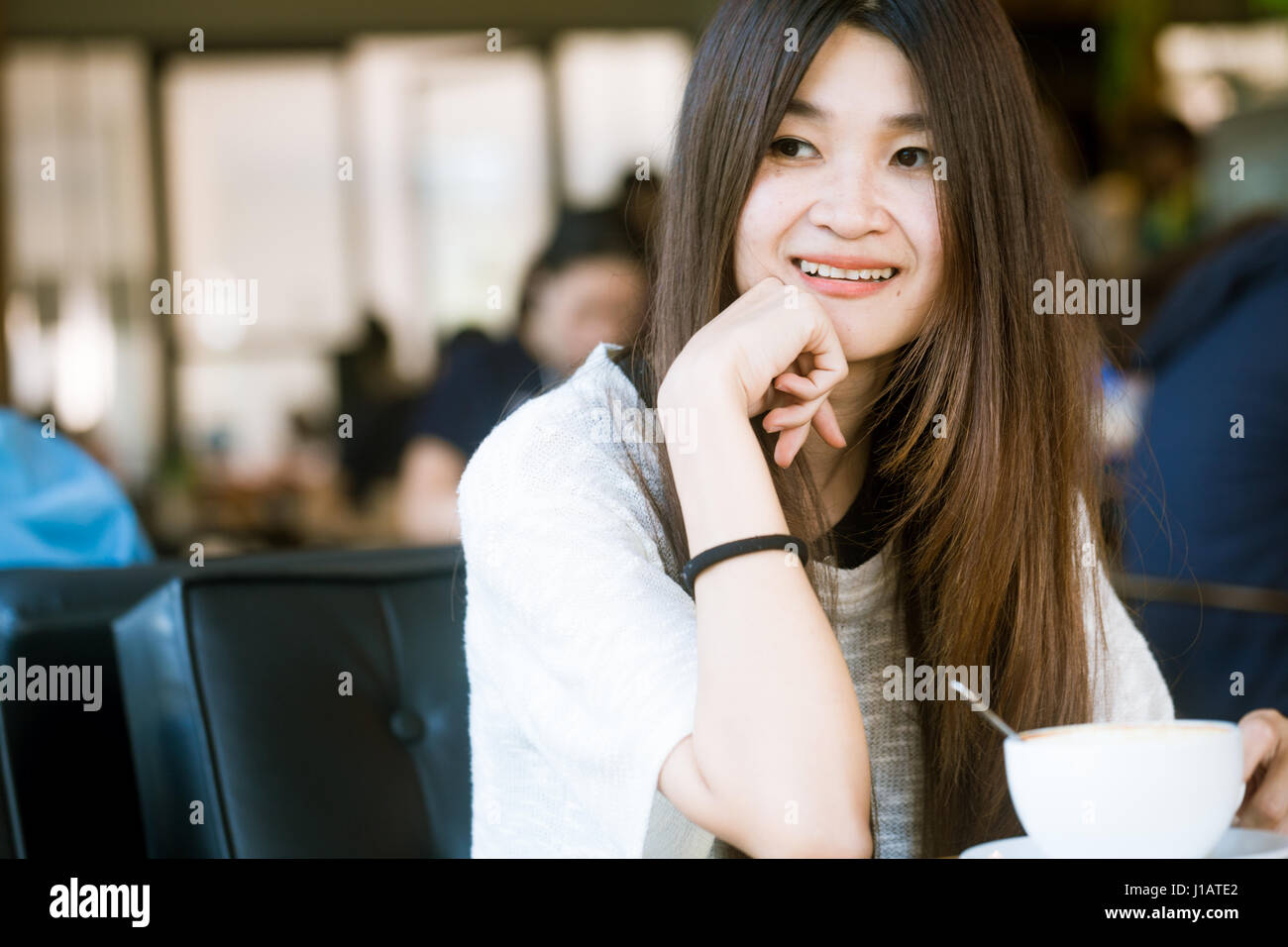 Coffee library portrait of asian university woman drinking latte art ...