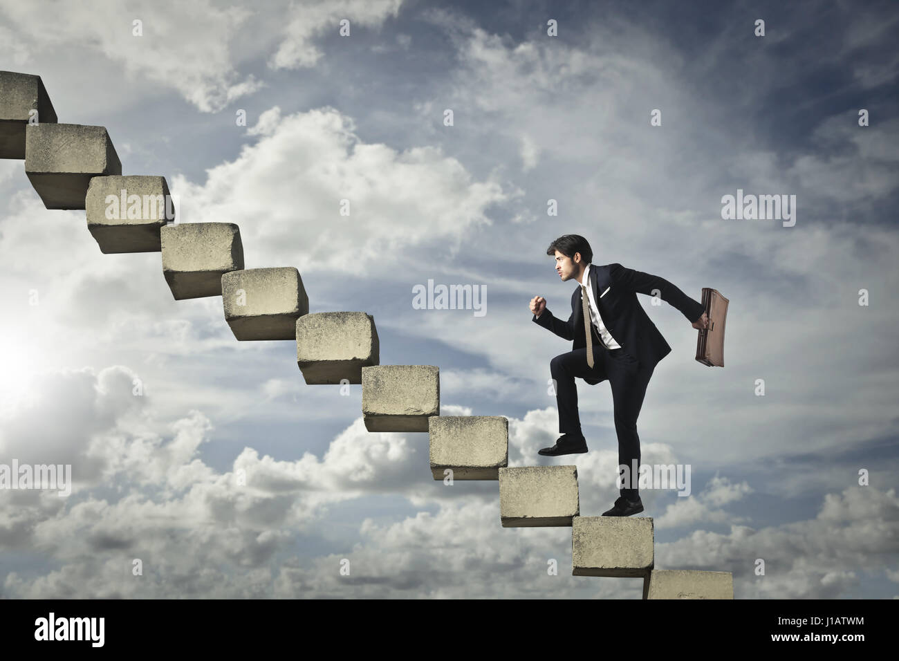 Businessman walking up on stairs Stock Photo - Alamy