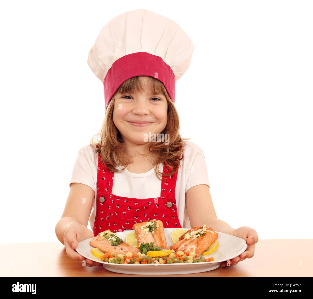 happy little girl cook with salmon seafood Stock Photo - Alamy