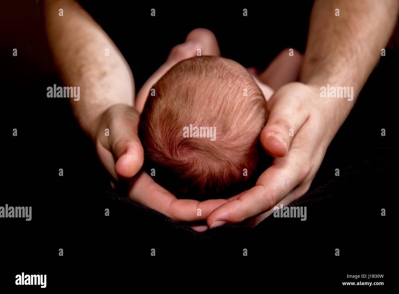 Cradled Baby High Resolution Stock Photography and Images - Alamy