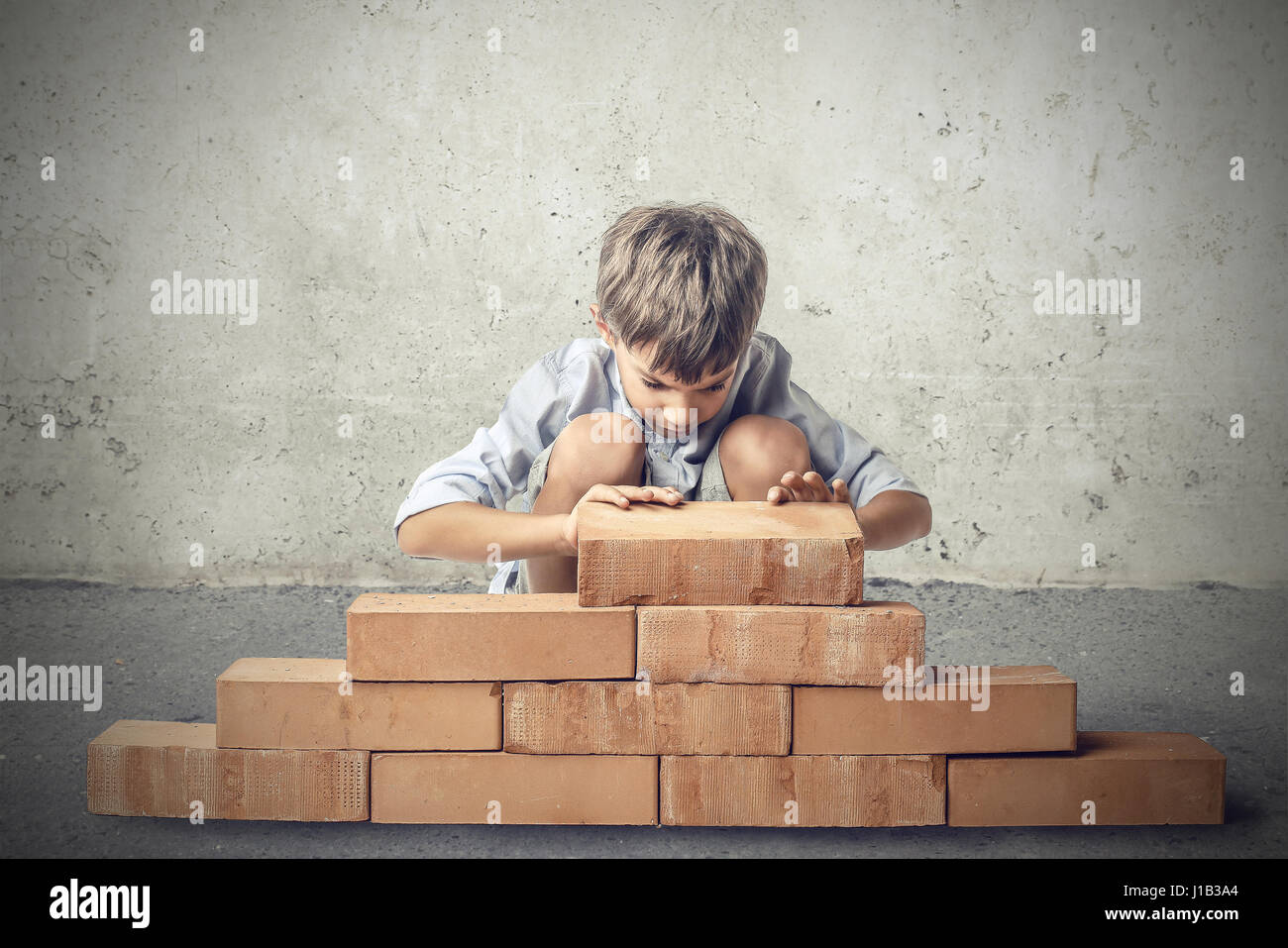 boy playing with bricks Stock Photo - Alamy